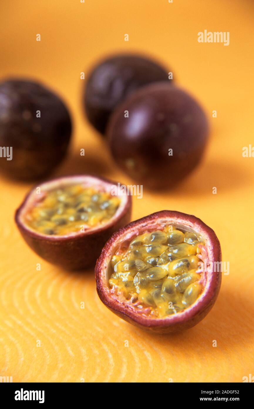 Passion fruit halves (Passiflora edulis). This tropical fruit is native ...
