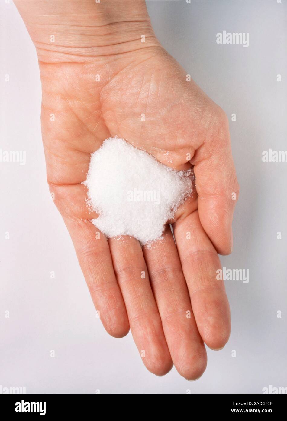 MODEL RELEASED. Monosodium glutamate (MSG). Handful of monsodium ...