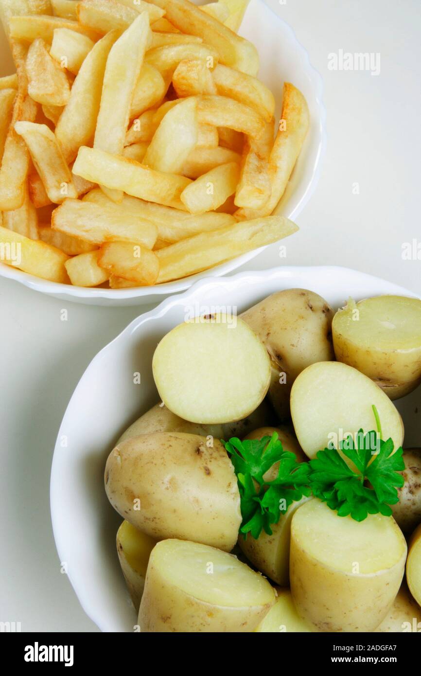 Bowls of chips and boiled new potatoes Stock Photo - Alamy