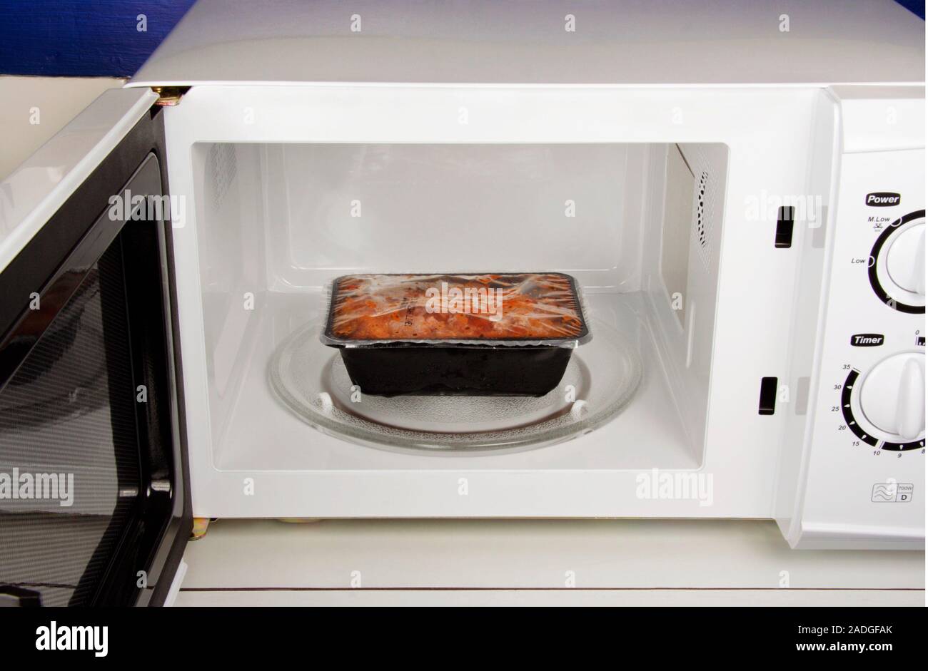 Microwave cooking. Cooked 'ready meal' inside a microwave oven ...