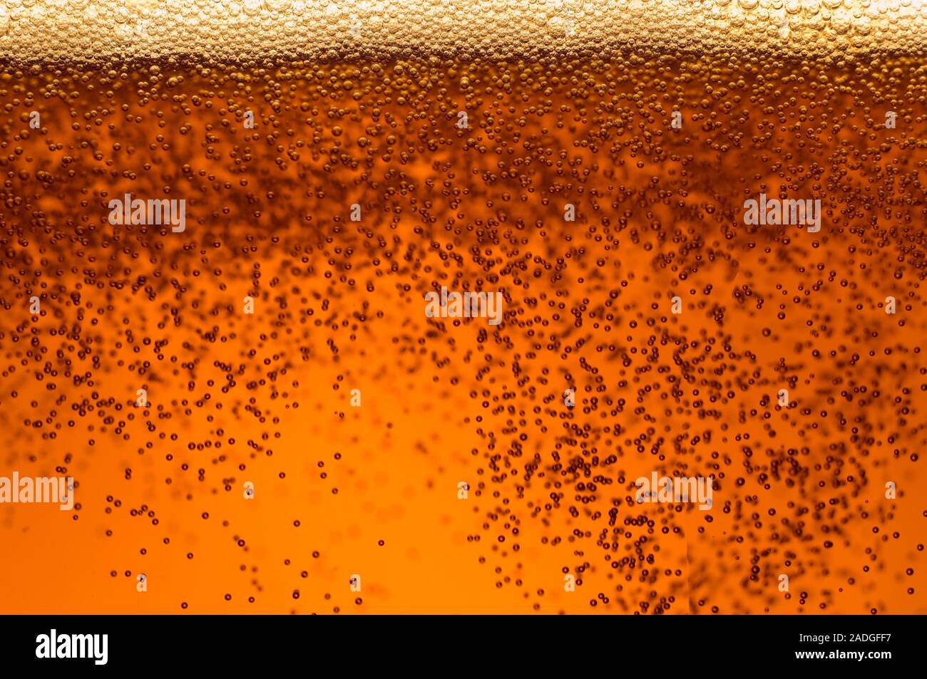 Carbonated soft drink. Bubbles rising to the surface in a cola drink ...