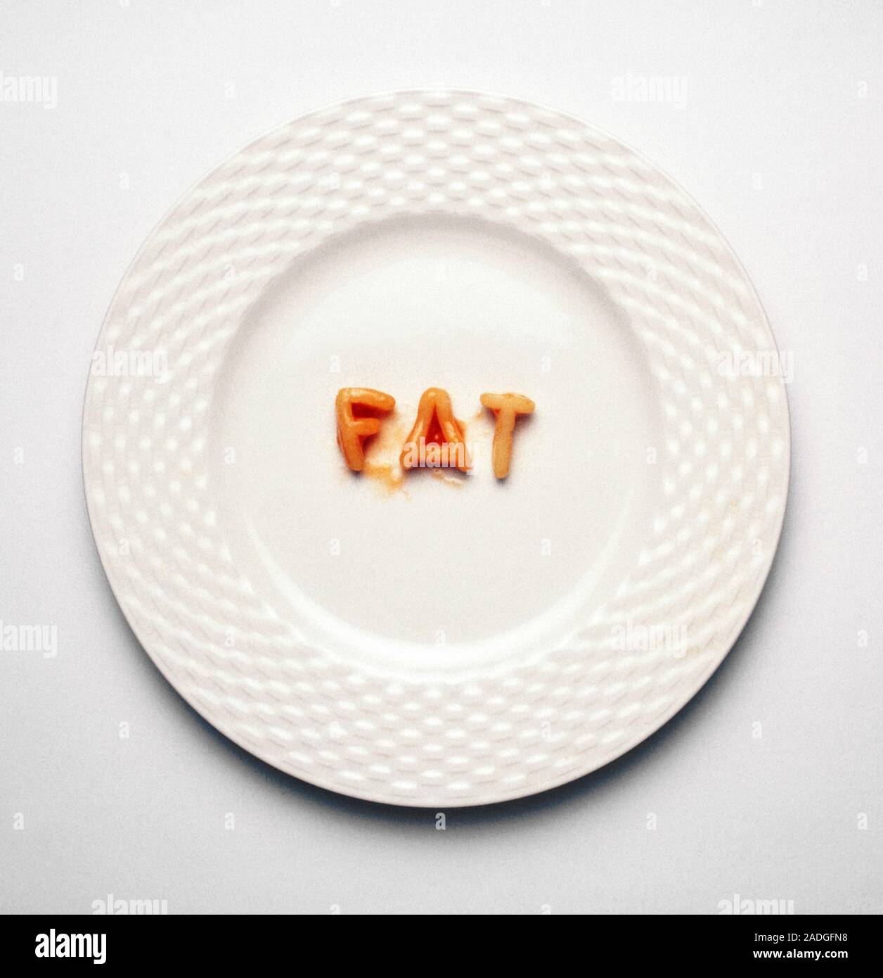 Fat. Conceptual image of the word 'fat' spelt out using alphabet shaped ...