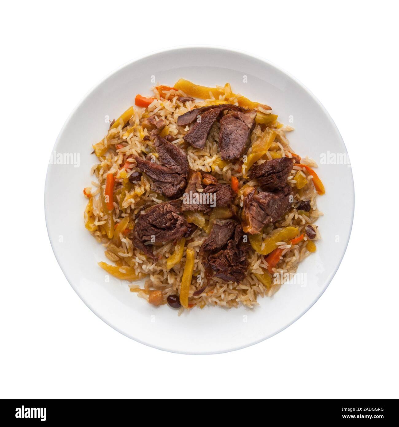 traditional pilaf with meat in a plate on a white background. Top view ...