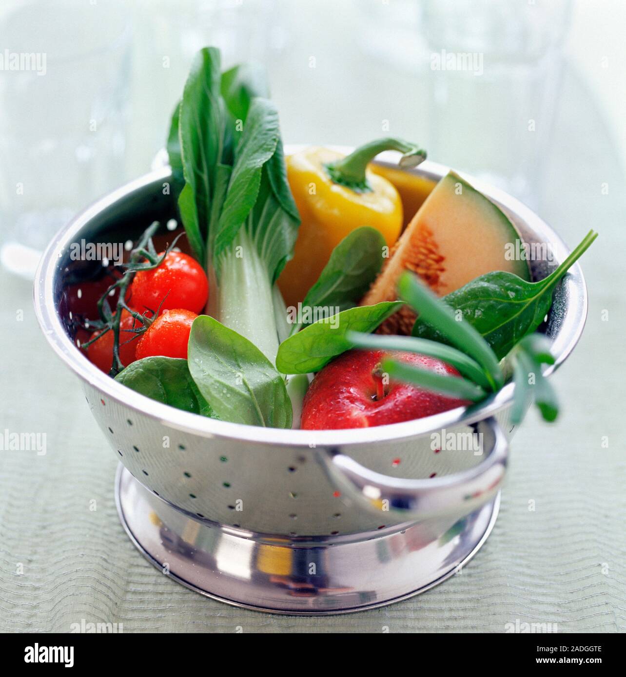 Fruit and vegetables in a colander Stock Photo - Alamy