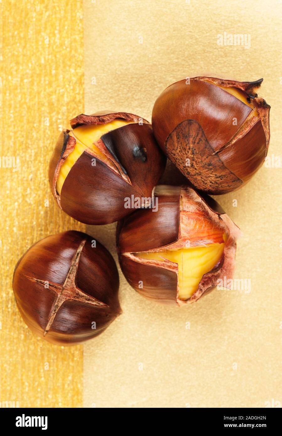 Roasted chestnuts with split shells. Nuts are a good source of ...