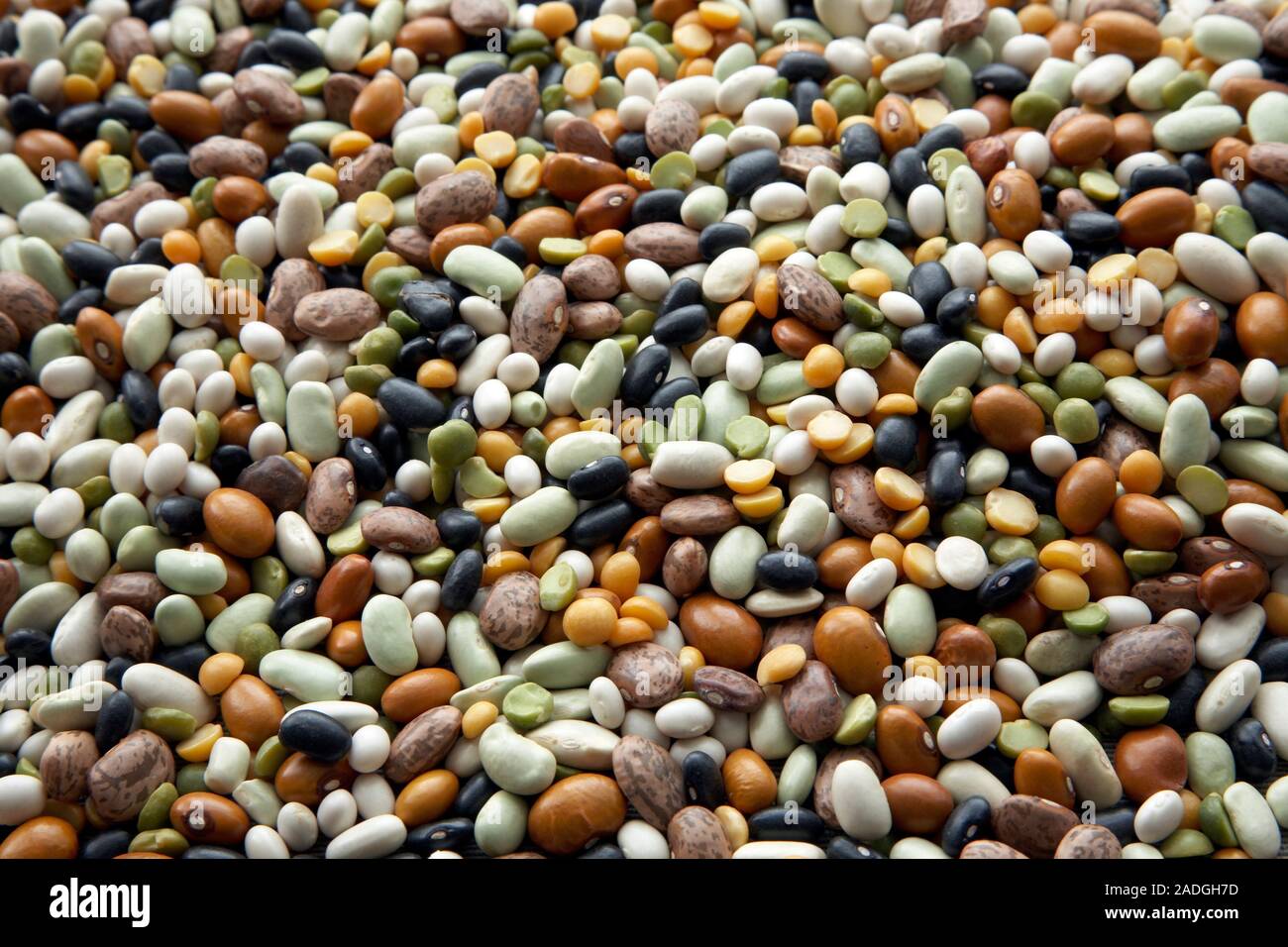 Dried pulses on a surface. These are flageolet beans, green and yellow ...