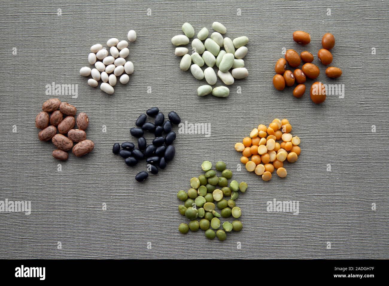 Dried pulses arranged on a surface. These are, from top left: haricot ...