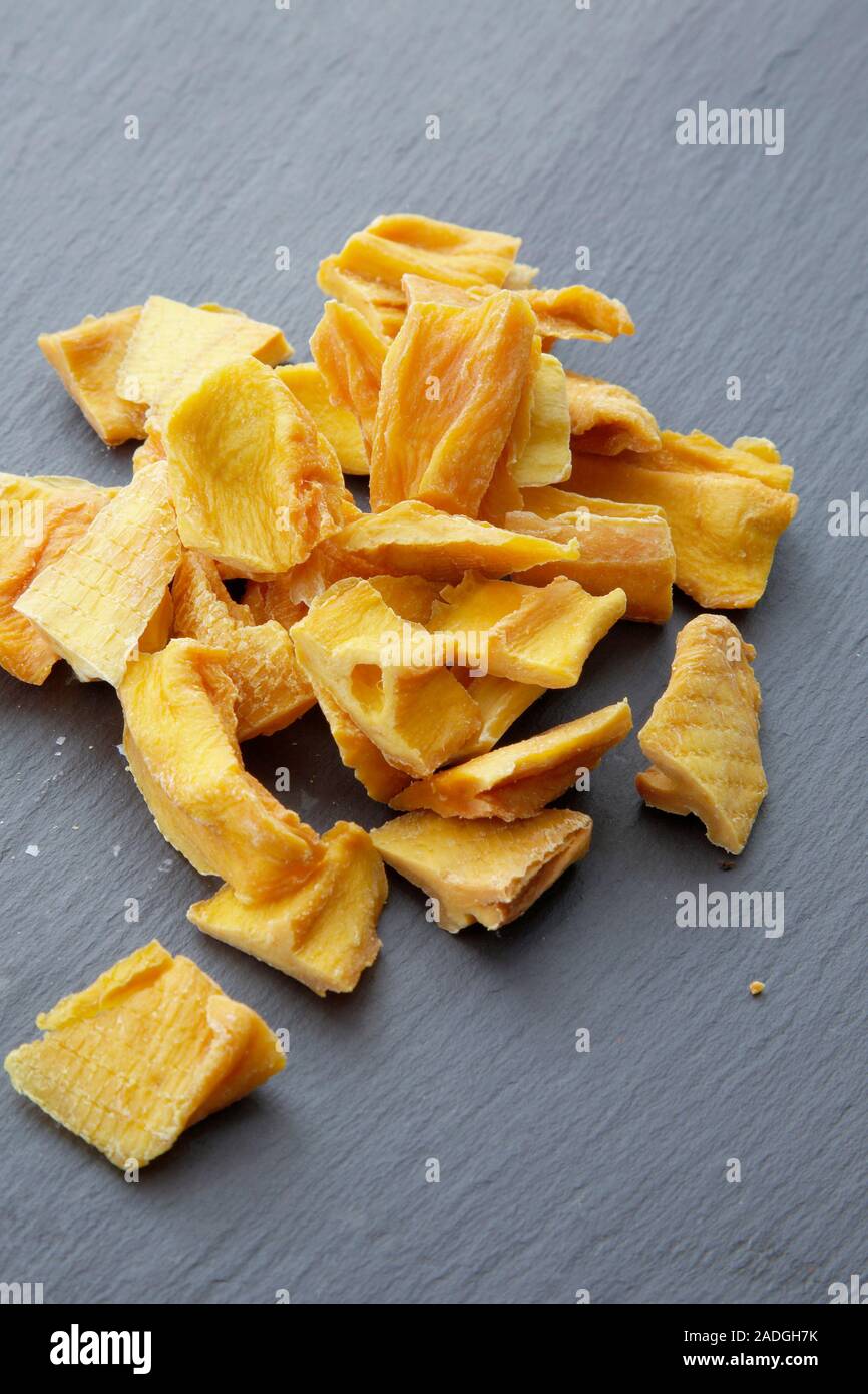 Dried mango pieces Stock Photo - Alamy