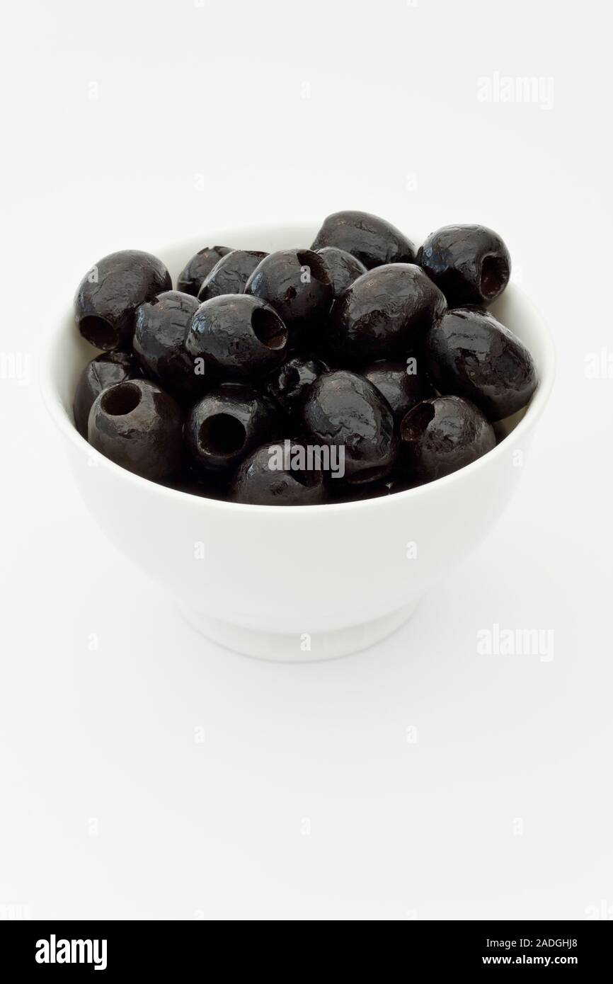 Pitted black olives (in oil Stock Photo - Alamy