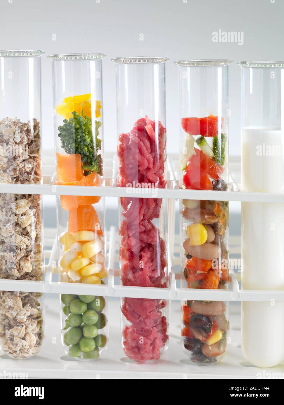 Balanced diet. Test tubes containing the components of a healthy diet ...