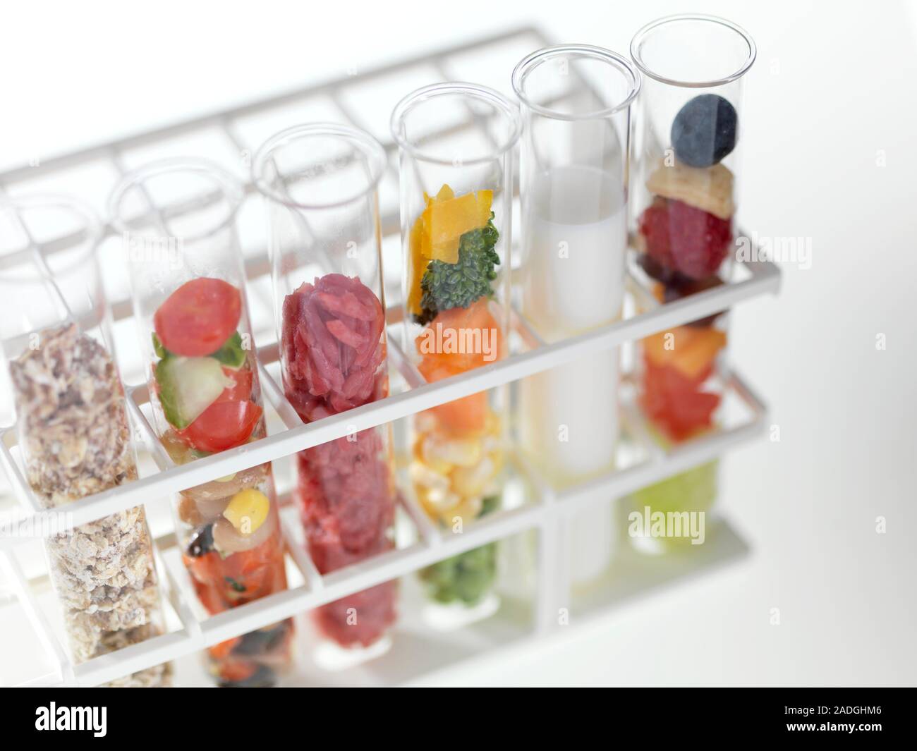 Balanced diet. Test tubes containing the components of a healthy diet ...