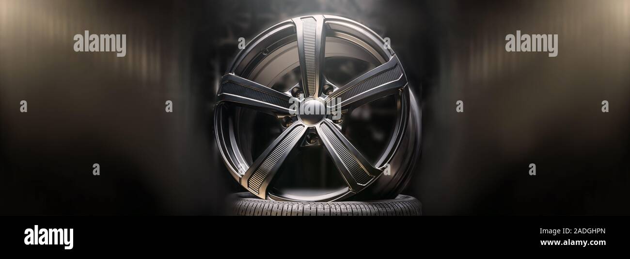 beautiful black alloy wheels made of aluminum on a dark background ...