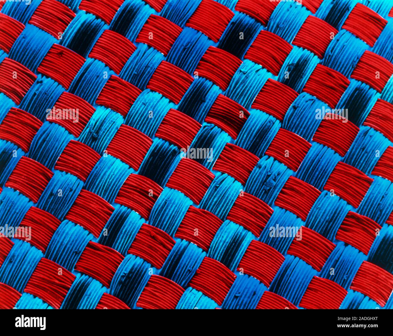 Rainproof fabric. Coloured Scanning electron micrograph of the ...