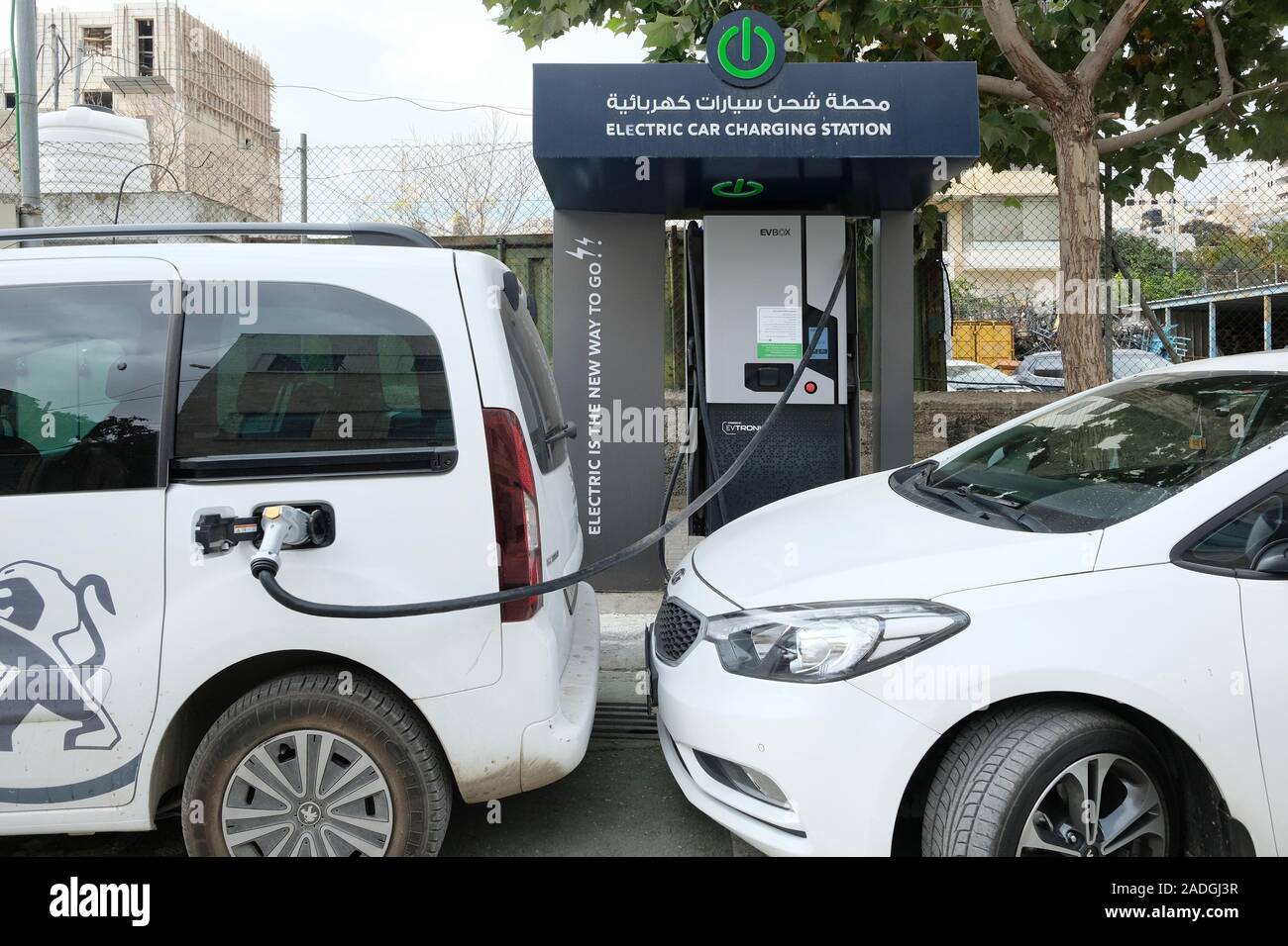 Car charging from an on-street electric car charging station in the ...