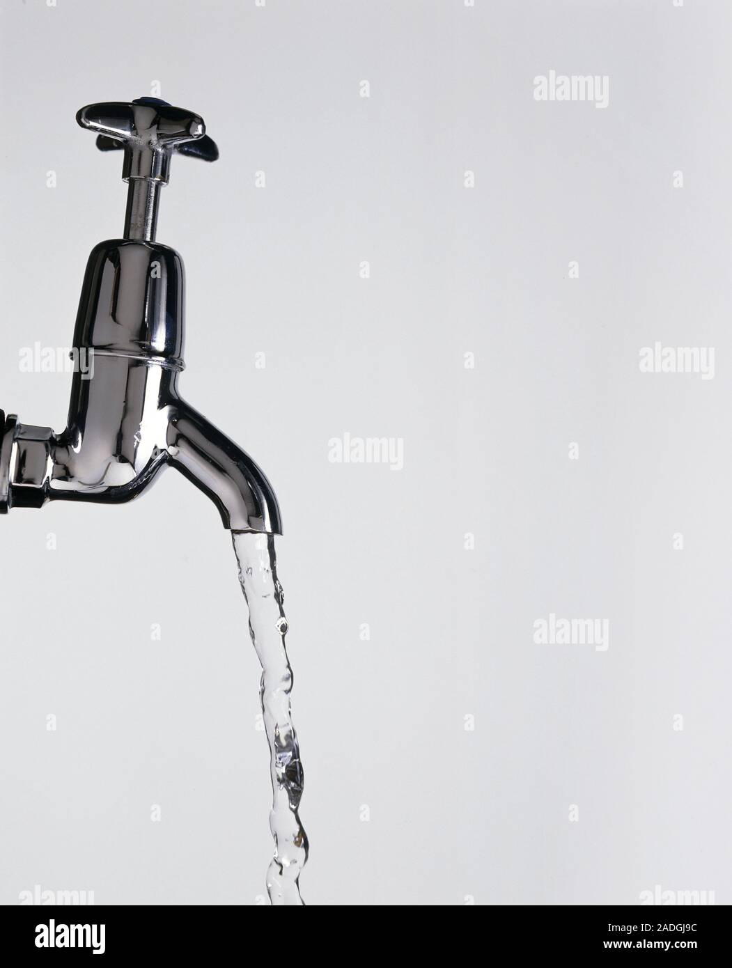 Water flowing from a tap Stock Photo - Alamy