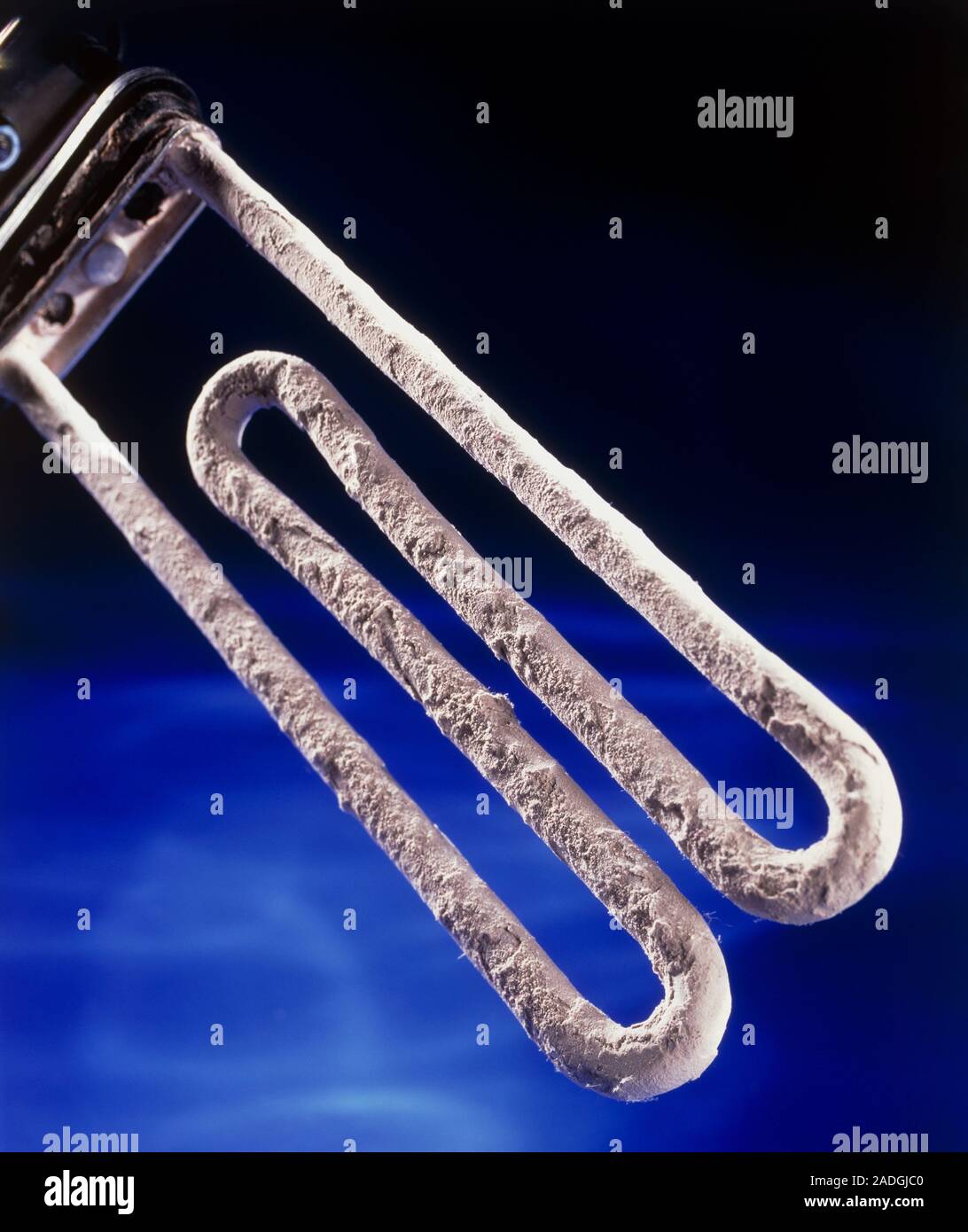 Limescale. Close-up of limescale on the electrical heating element of a ...