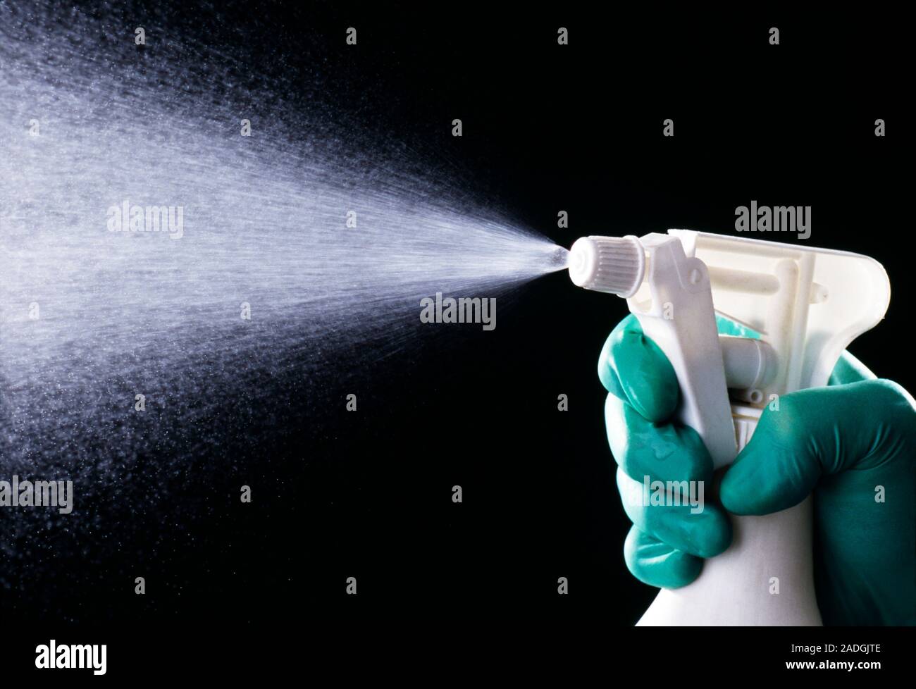 Cleaning. Liquid being ejected from a plastic spray bottle Stock Photo ...