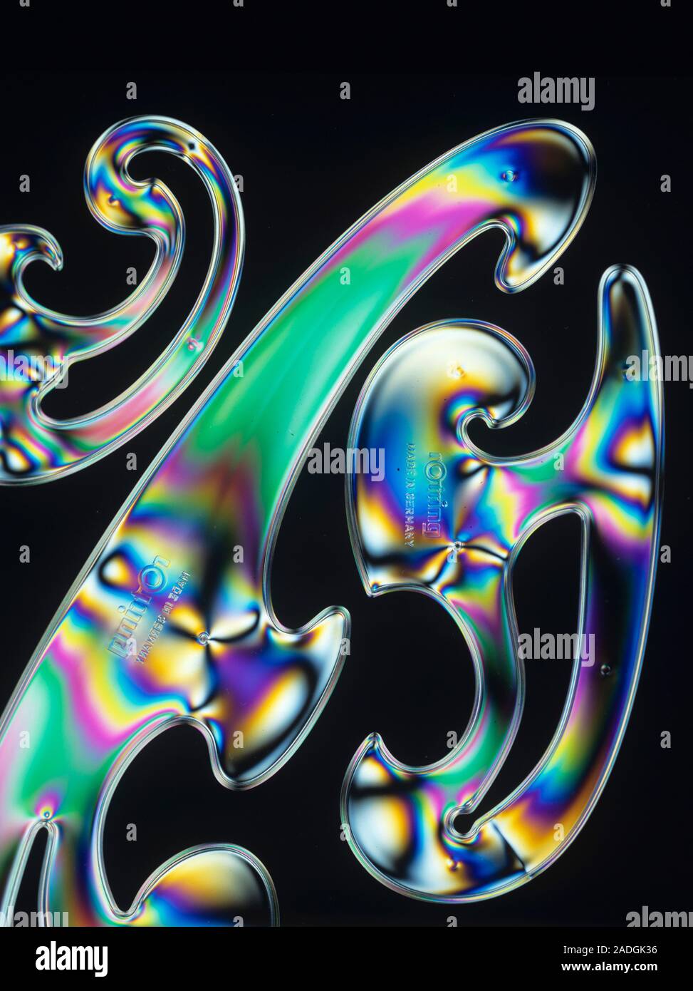 Photoelastic stress patterns of French curves, viewed using polarised ...