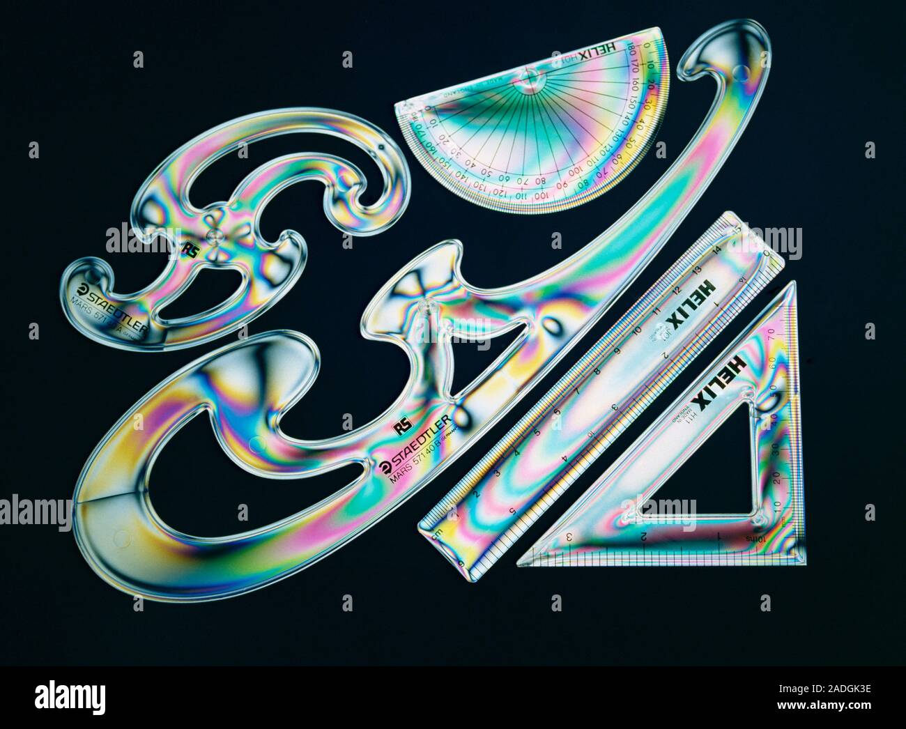 Photoelastic stress patterns of drawing equipment, viewed using ...