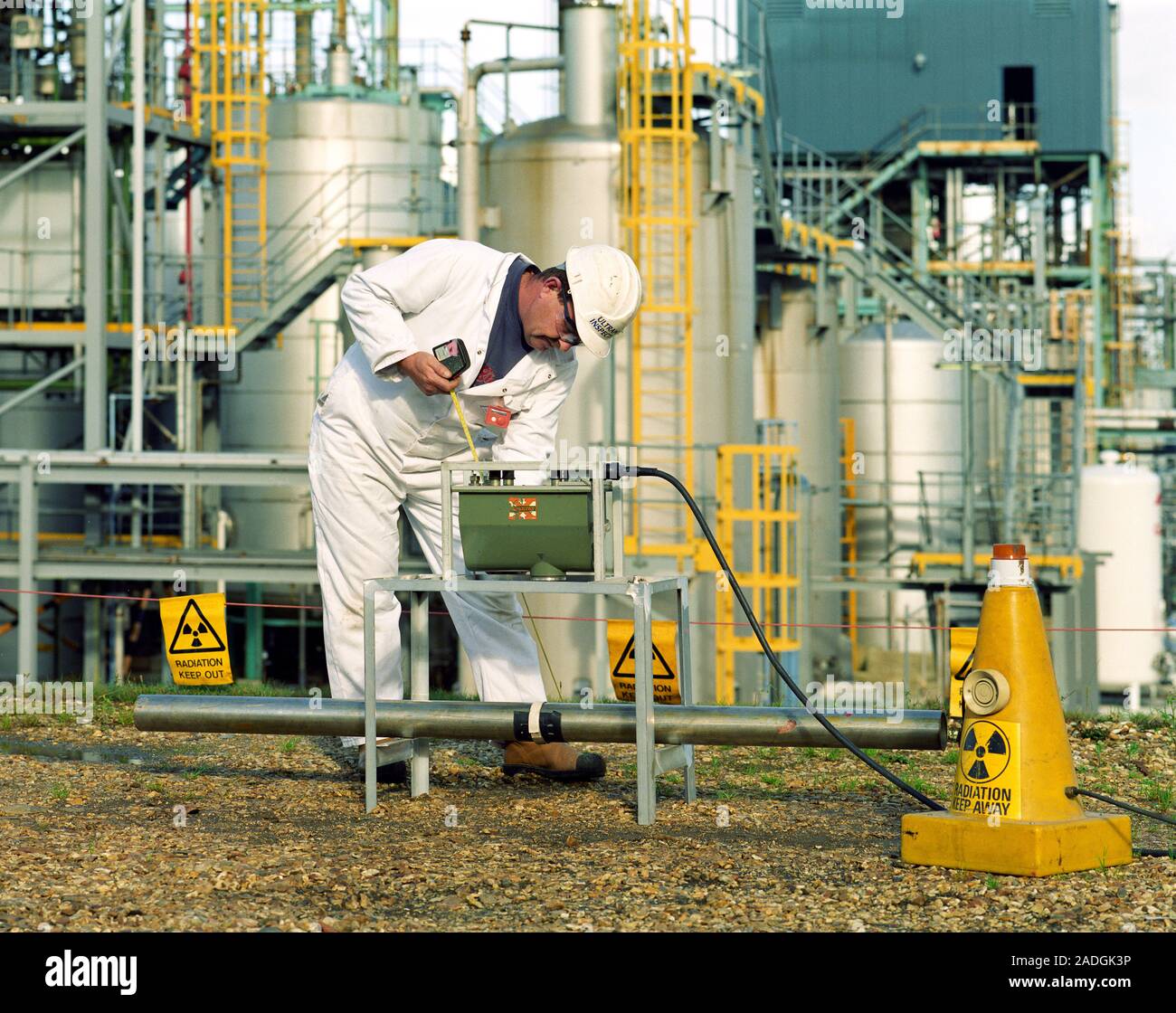 Radiographic testing of a pipe. The technician is using an X-ray ...