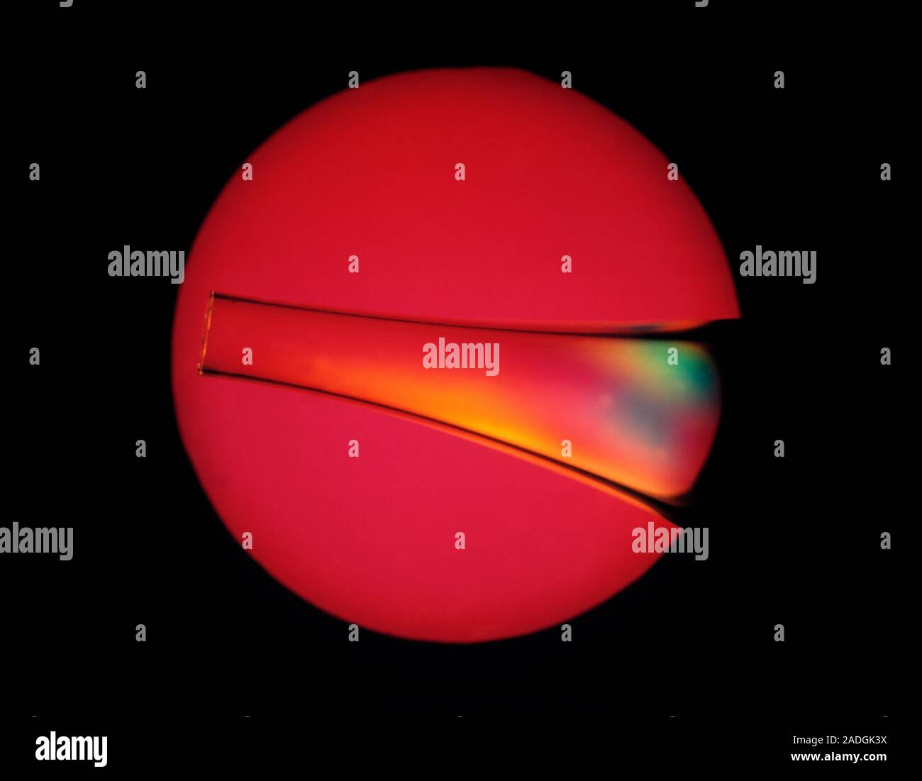 Defects of plastic. Polarised light micrograph showing the defects of a ...