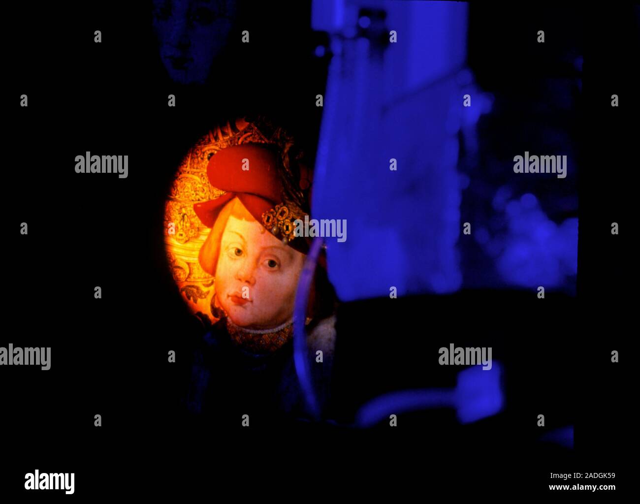 Art forgery detection. Infra-red scanner illuminating a section of a ...