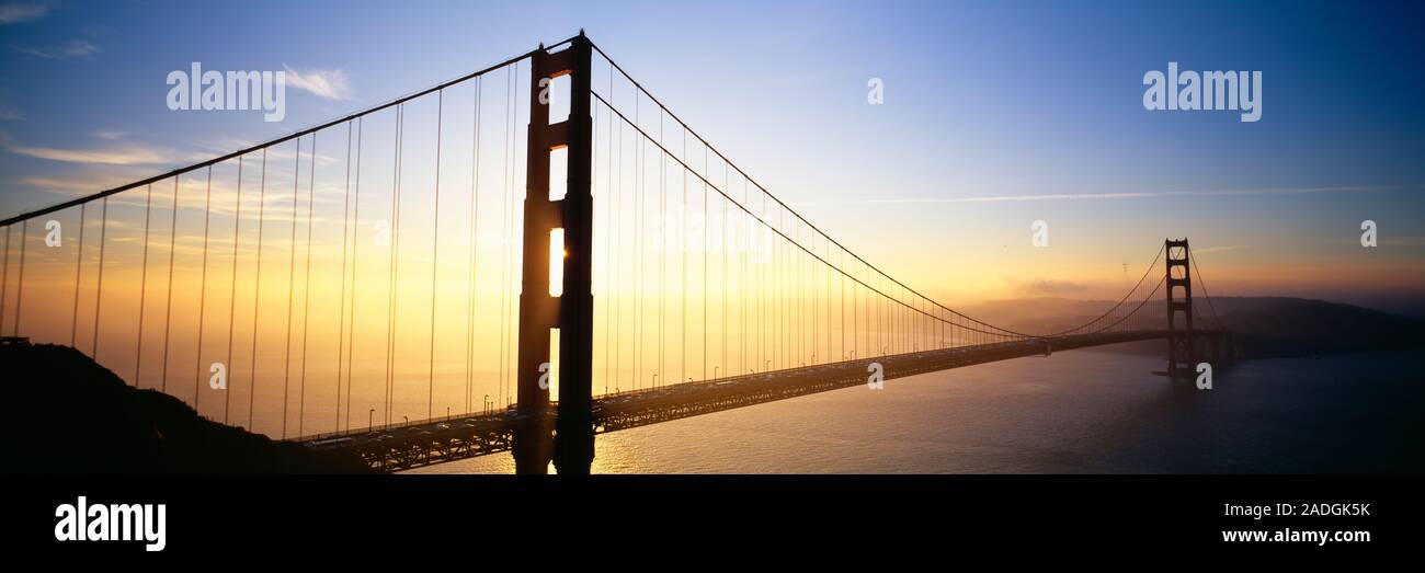 Silhouette of a bridge at dawn, Golden Gate Bridge, San Francisco ...