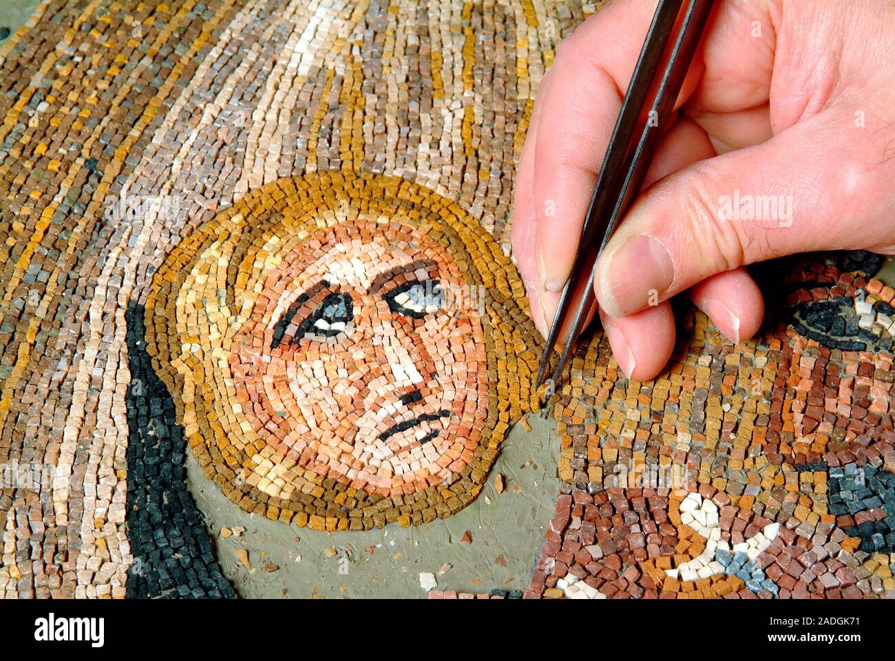 Battle of Issus mosaic reconstruction. Restorer working on a ...