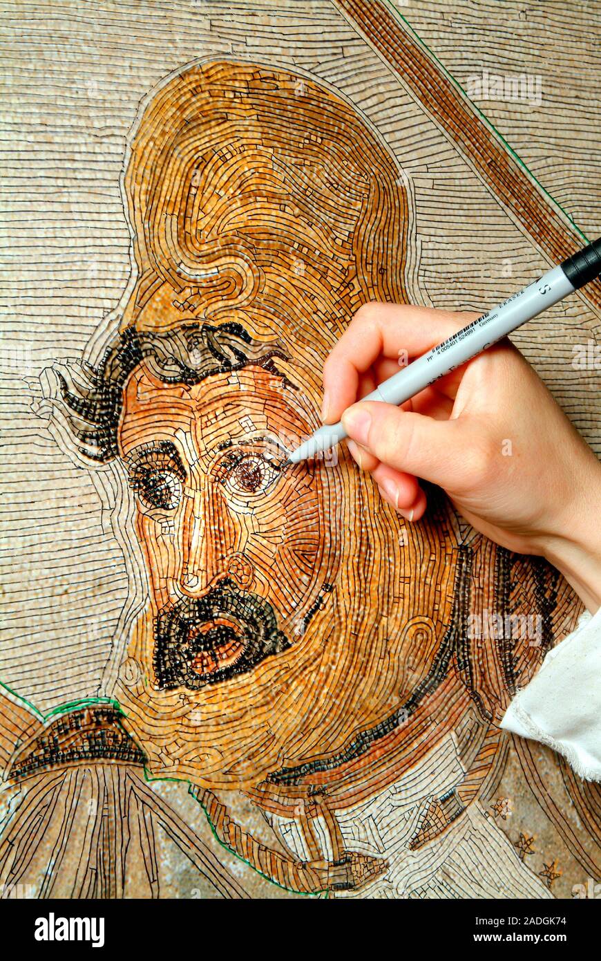 Battle of Issus mosaic reconstruction. Restorer working on a ...