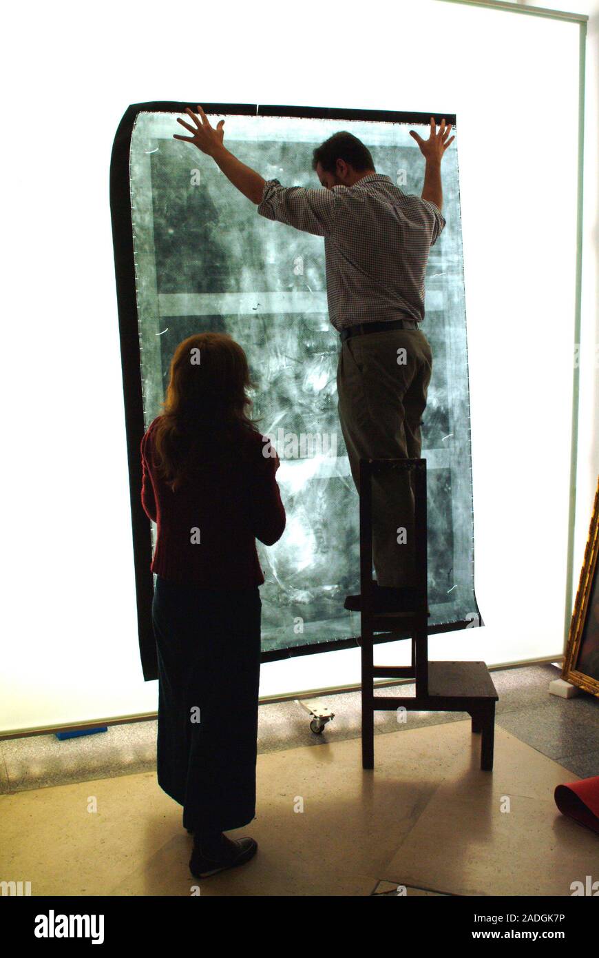 Art history laboratory. Art historians working with a 1:1 scale X-ray ...