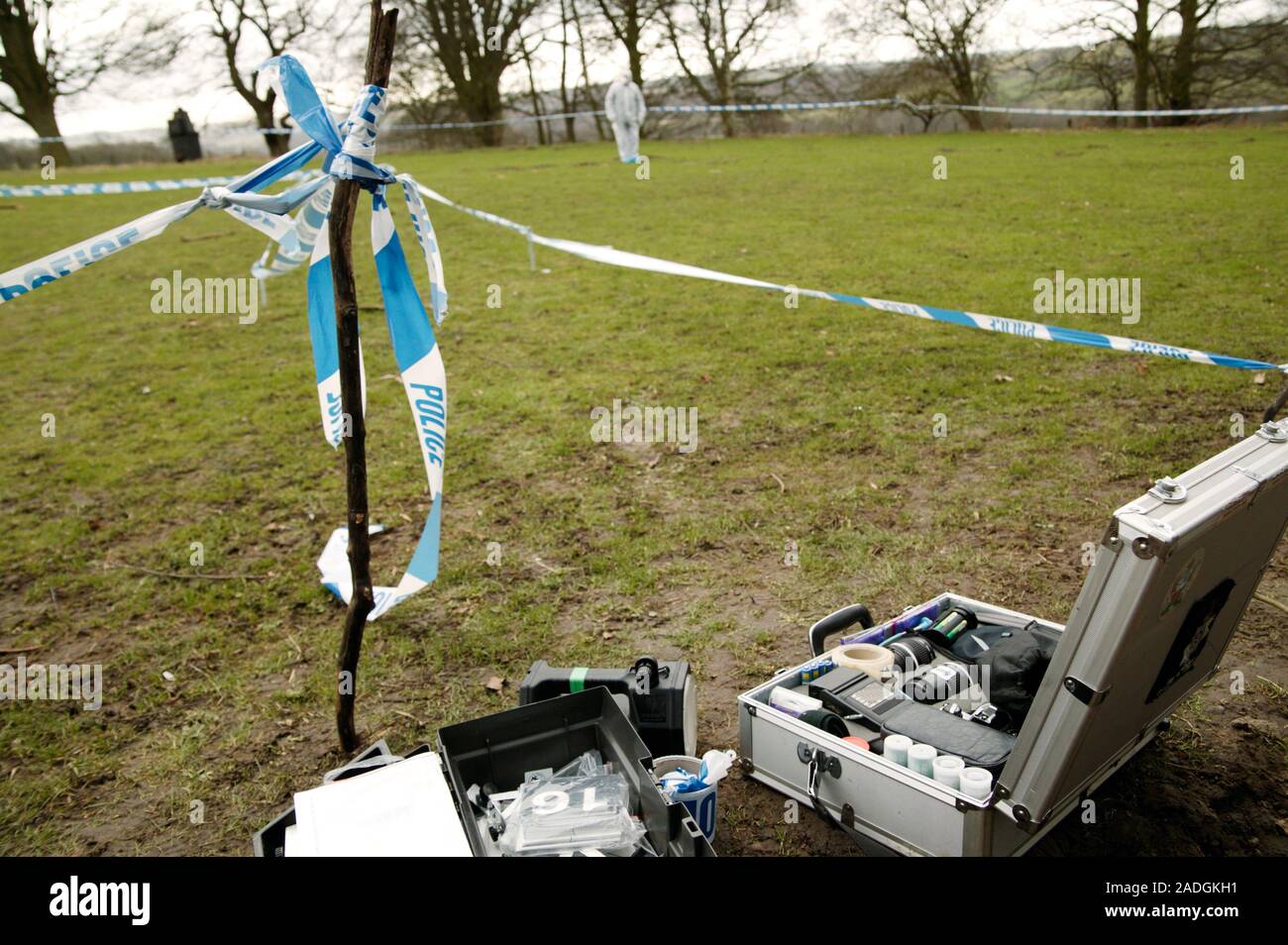 Forensics. Boundaries of a crime scene marked out by scene of crime ...