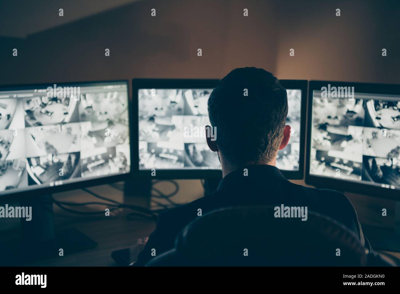 Rear back behind view of his he professional expert supervising remote ...