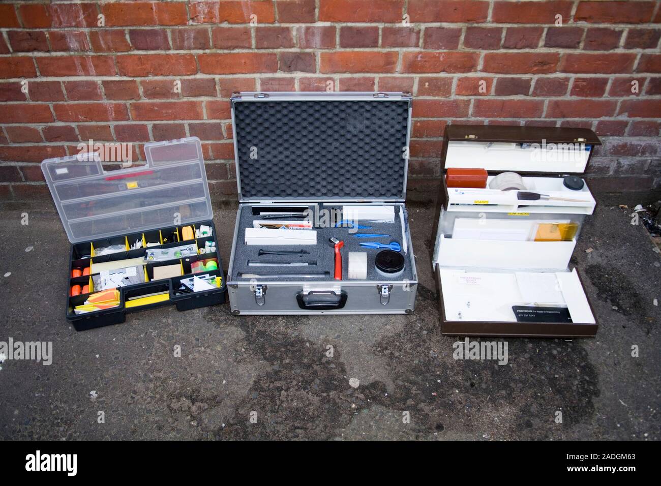Forensic equipment in open cases ready to use at a crime scene ...