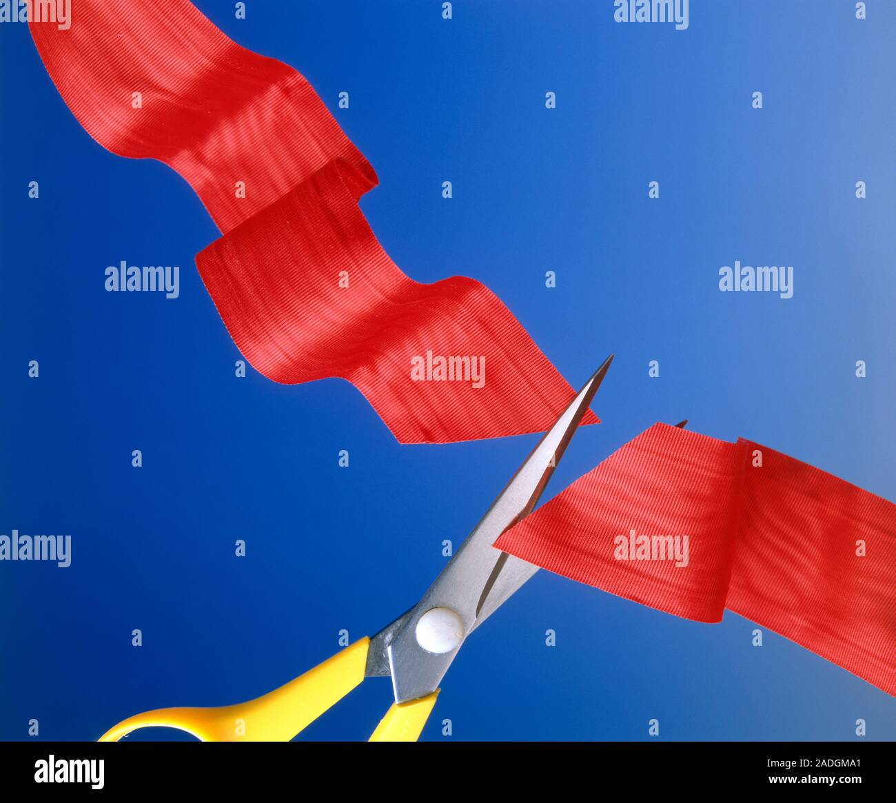 Scissors cutting red ribbon tape Stock Photo - Alamy