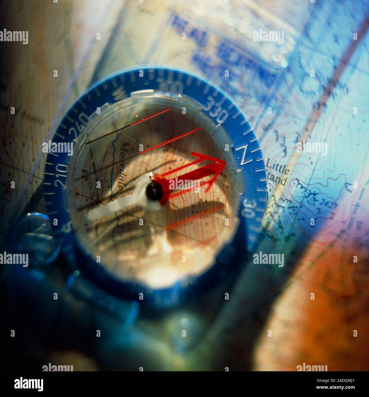 Magnetic compass. Magnetic compass on a map. The compass has a free ...