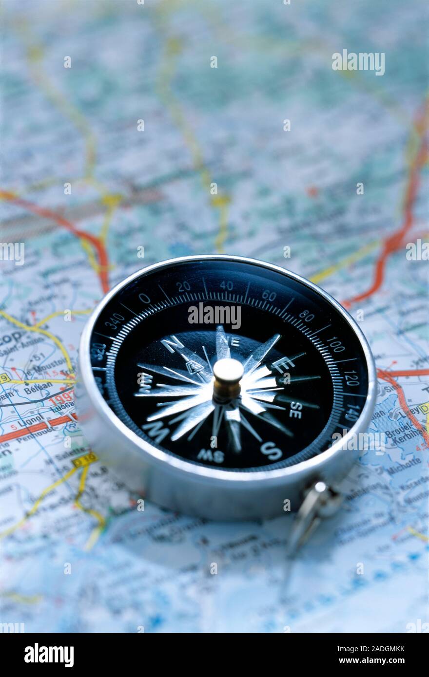 Magnetic compass. Stroboscopic image of a compass on a map. The ...