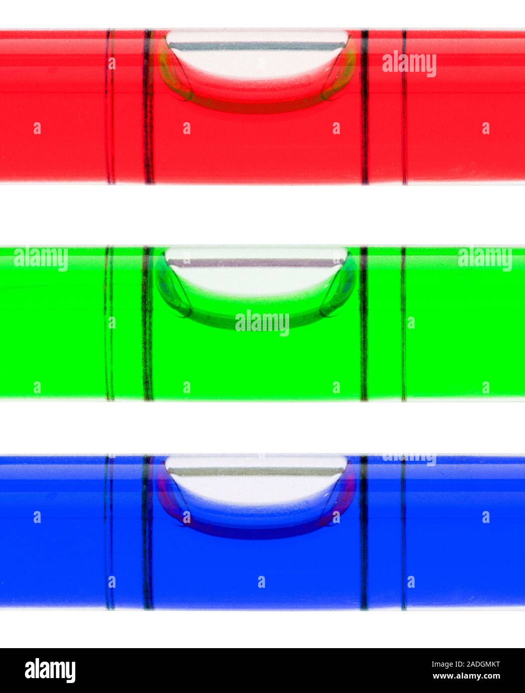 Spirit levels. Close-up of three spirit levels in the primary colours ...
