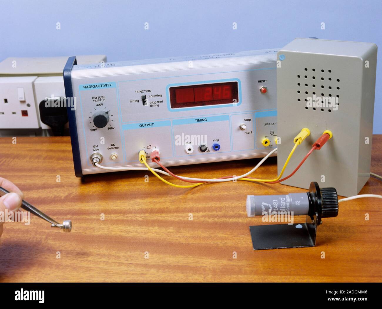 Geiger-Muller tube. Experiment with a radioactive source (lower left ...