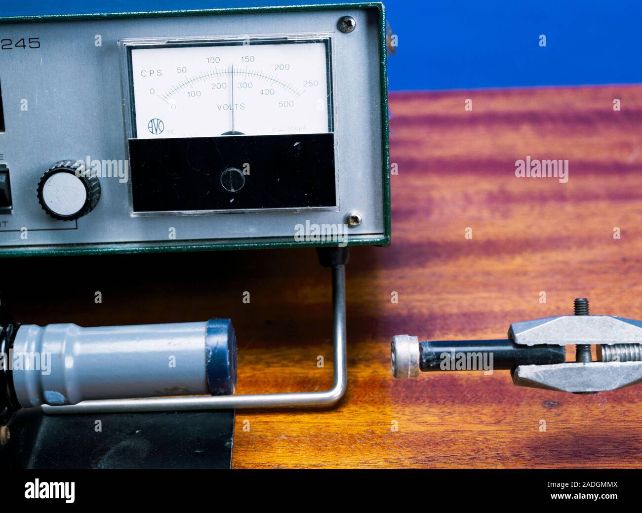Geiger-Muller tube measuring radiation from a source, with a ratemeter ...