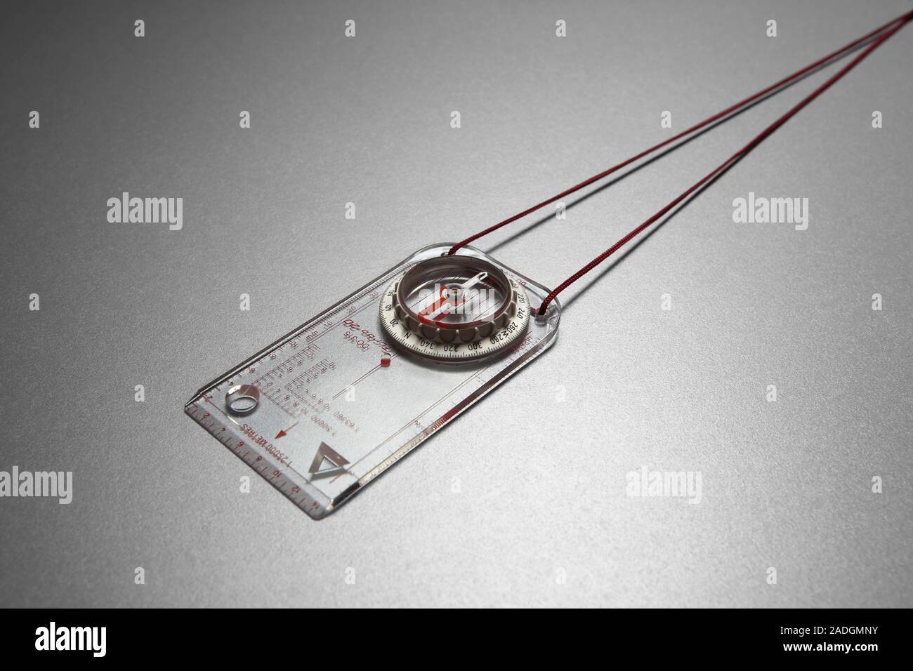 Compass. The needle aligns itself with Earth's magnetic field ...