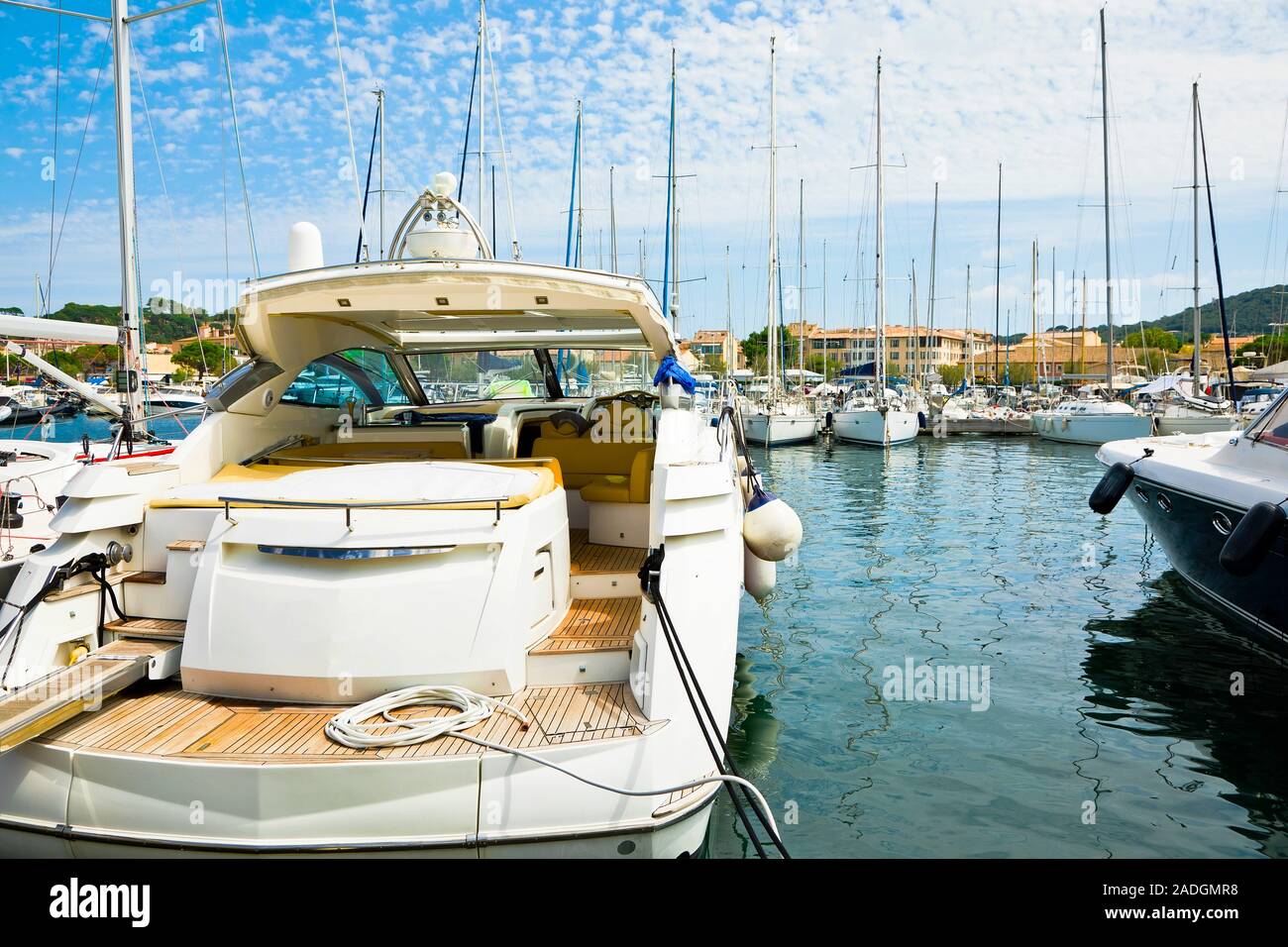 Back view on yacht docking in calm port during summer day Stock Photo ...