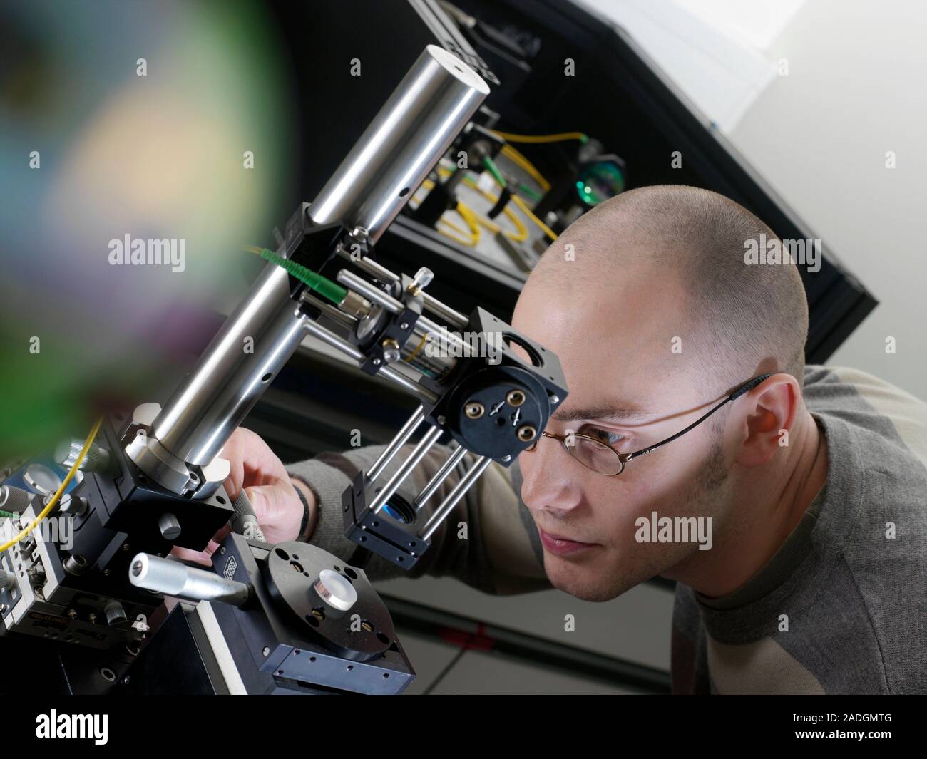 Optical tomography scanner. Scientist setting up his optical coherence ...