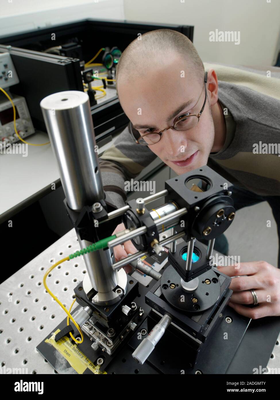 Optical tomography scanner. Scientist setting up his optical coherence ...