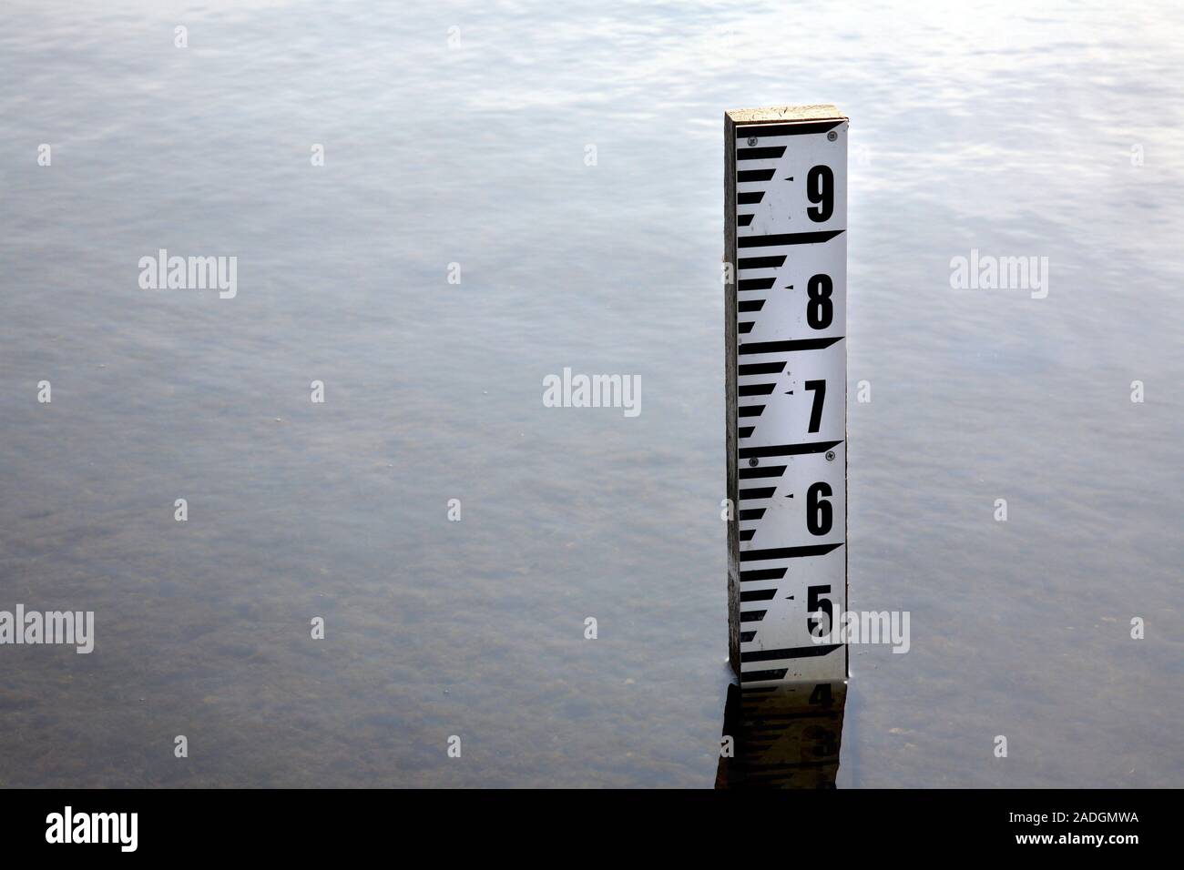 Water depth marker. Marker indicating the depth of a body of water ...