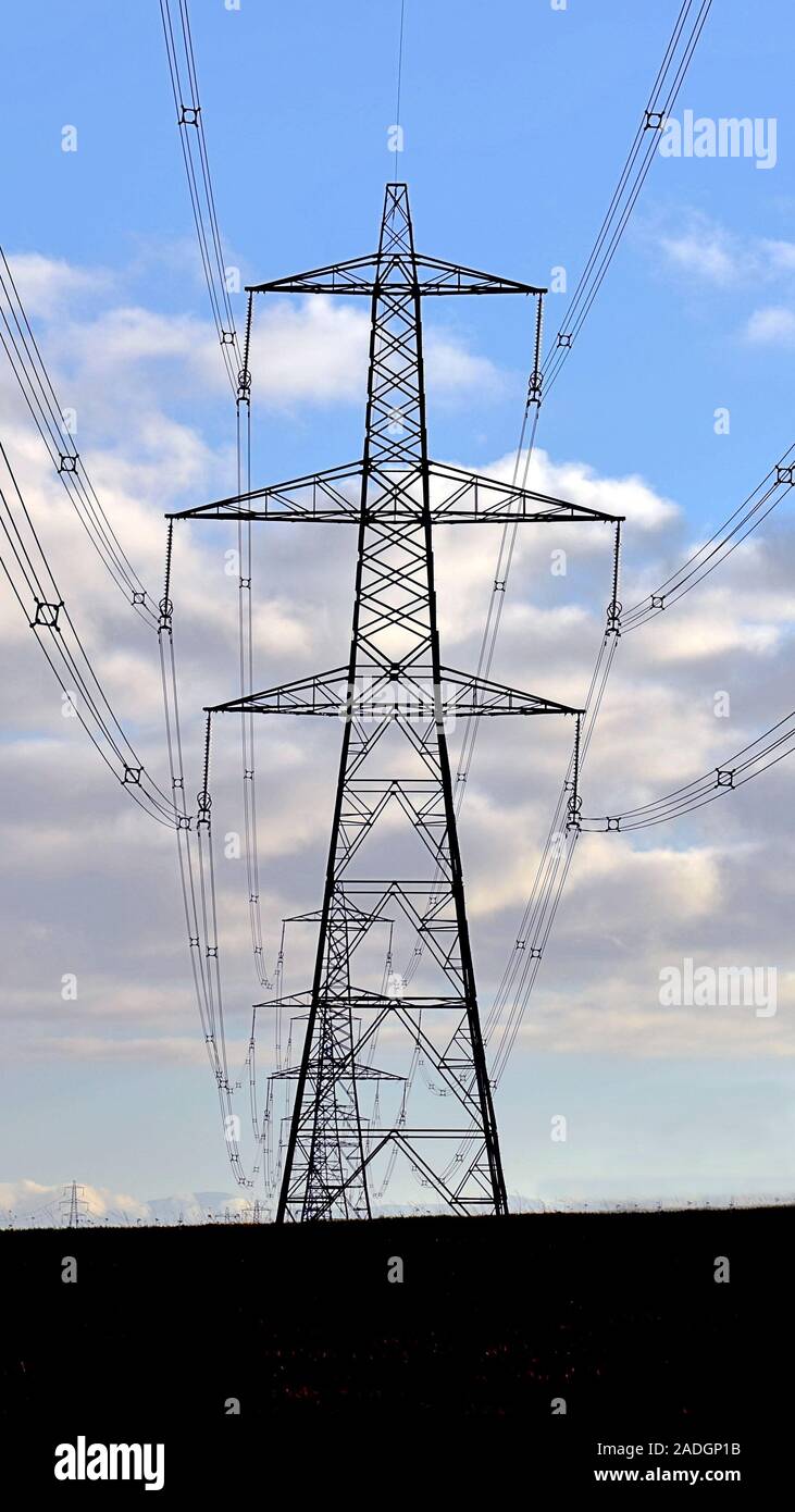 Electricity pylon pictured against the sky Stock Photo - Alamy