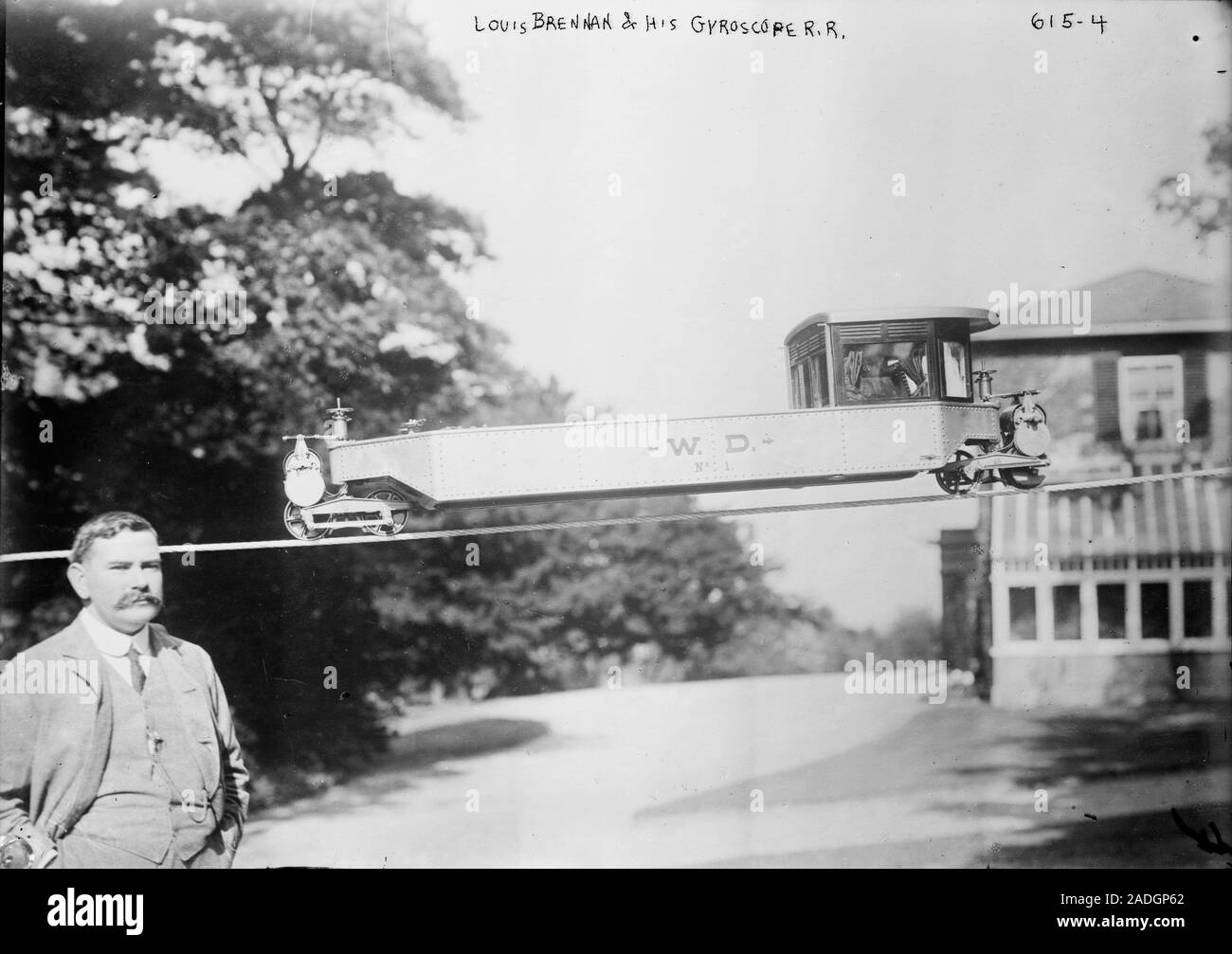 Louis Brennan with his Gyro-Monorail in New York. The Brennan Gyro-Monorail was balanced by two ...