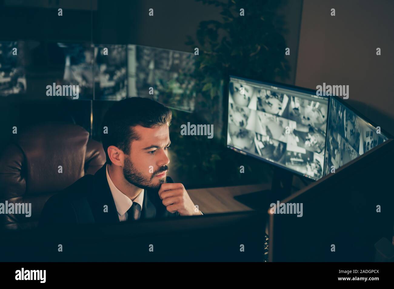 Portrait of his he nice attractive serious focused man watching ...