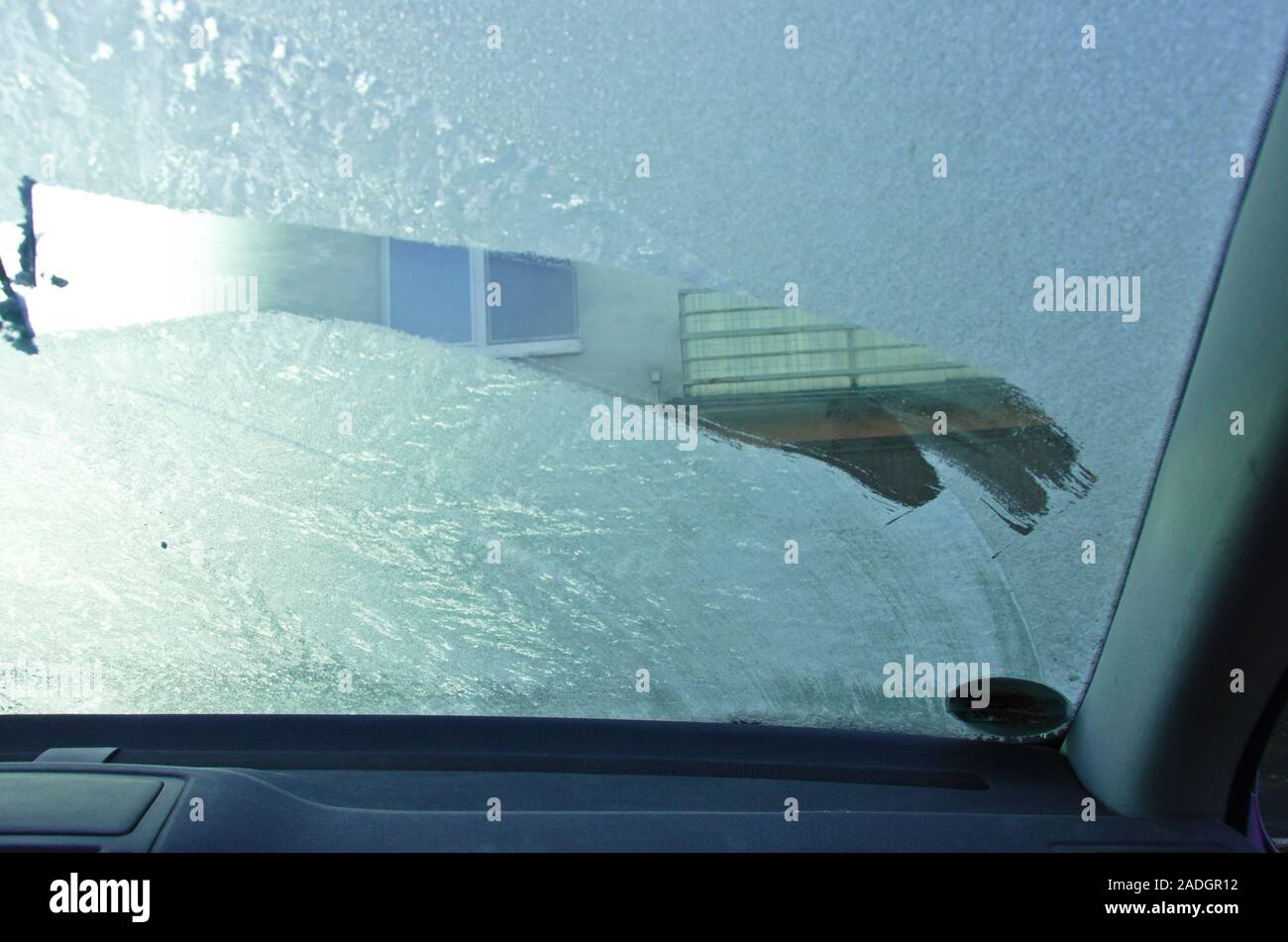 A frozen front windshield of a car from inside view Stock Photo - Alamy