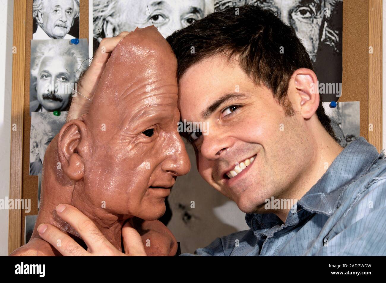 David Hanson (born 1969), US robot designer, holding a Frubber mask ...