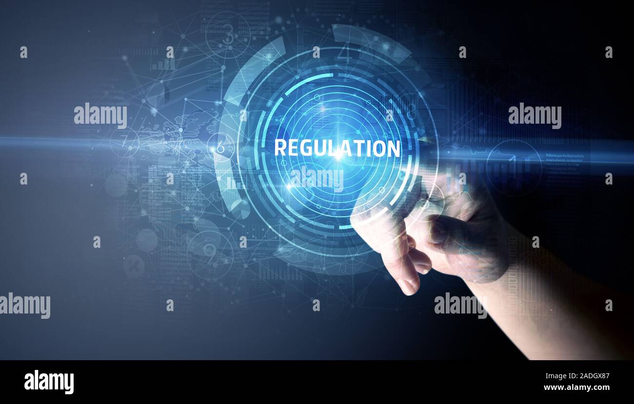 Hand touching REGULATION button, modern business technology concept ...
